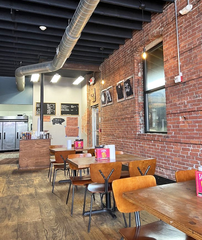 Industrial chic meets barbecue functionality. Those exposed ducts aren't just for show—they're carrying the aroma of smoked meat to heaven.