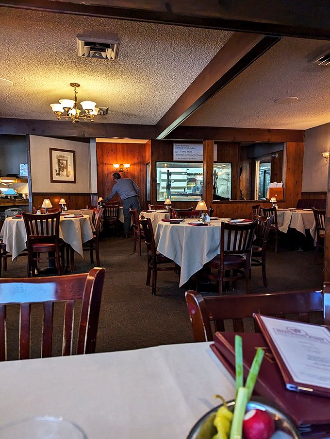 The dining room waits expectantly before service, like a theater before the curtain rises on the evening's delicious performance.