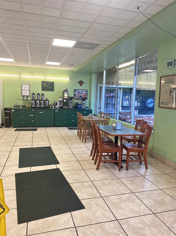 Simple wooden chairs and tiled floors set the stage for donut enjoyment. No distractions from the main event—just you and your pastry soulmate.