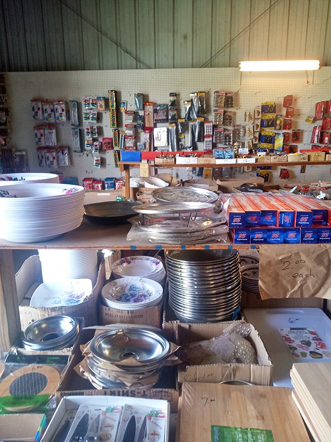 Kitchen history on display. These plates and pans have served countless meals before arriving here&mdash;some destined to become wall art, others ready for more cooking.