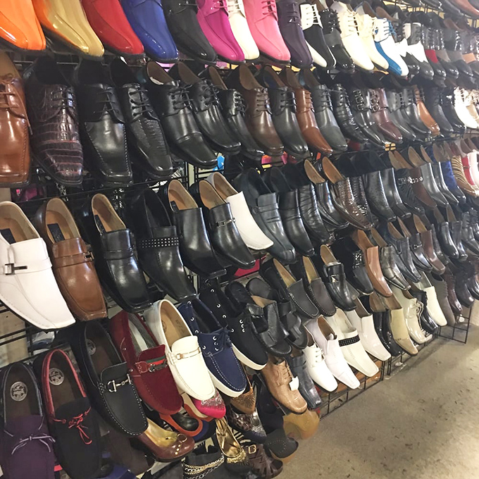 A wall of men's footwear that would make Imelda Marcos weep with joy. Every color, every style, every possible foot fantasy.