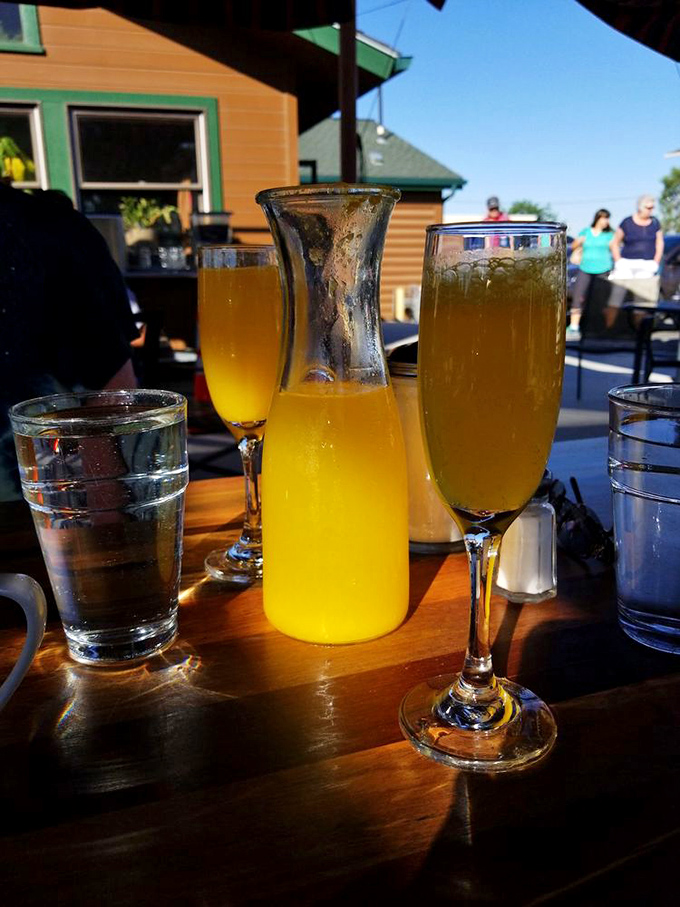 Mimosas in the morning sunshine&mdash;because vacation rules apply when the food is this good. That pitcher promises a leisurely brunch ahead.