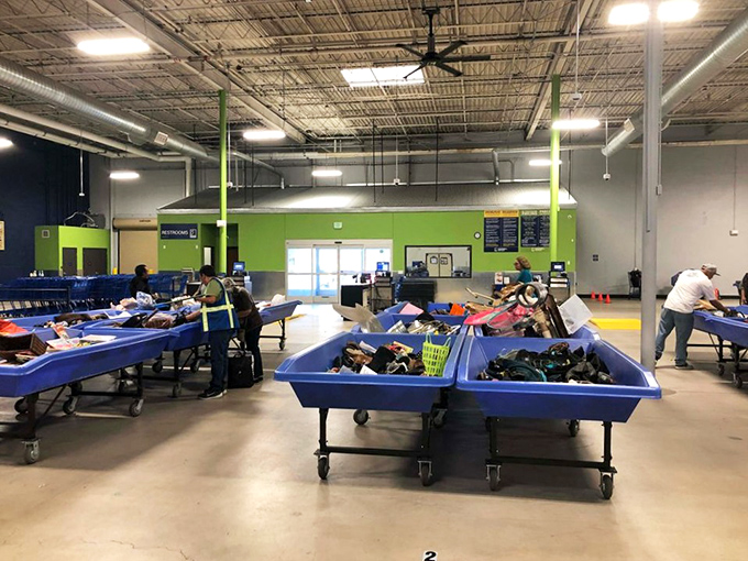 Fresh bins rolling out is the thrifting equivalent of a dinner bell. The unspoken etiquette: no grabbing, no shoving, just strategic positioning.