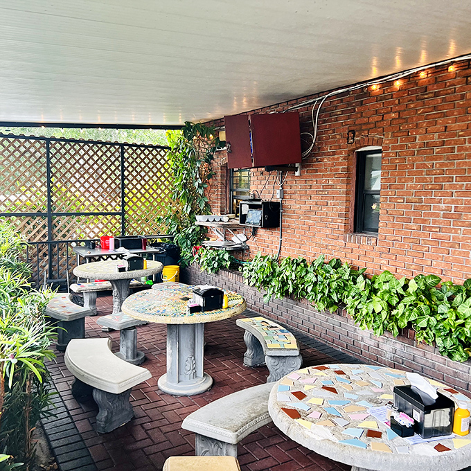 The outdoor patio's mosaic tables tell stories of countless conversations, first dates, and "remember when" moments shared over exceptional burgers.