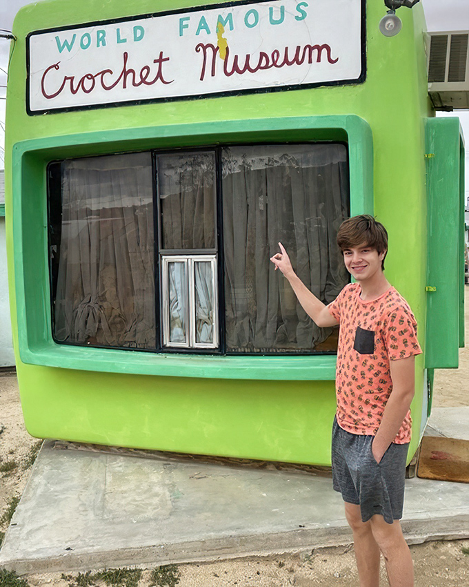 The bright orange door welcomes visitors into what might be America's most concentrated display of crochet artistry.