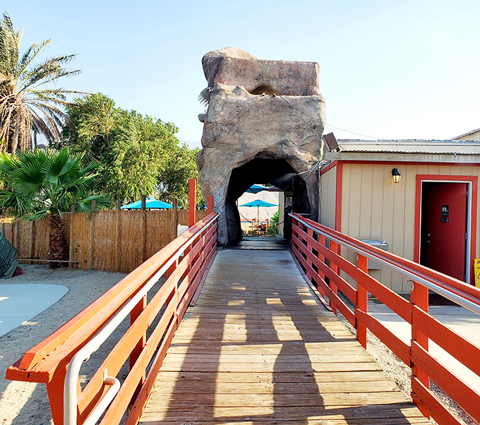The bridge to adventure! This wooden walkway leads visitors through a rock formation that's seen more selfies than a Hollywood premiere.