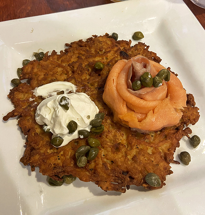 A potato pancake that's dressed to impress, with smoked salmon and capers creating a symphony of flavors that would make any babushka proud.
