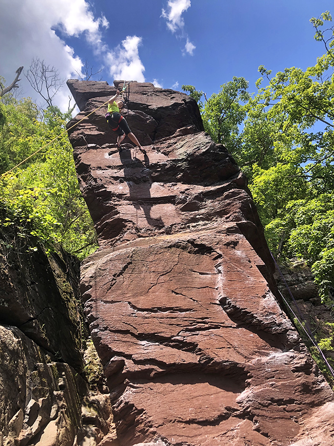 Rock climbers scale these impressive cliffs like vertical chess players, calculating each move with precision while gravity waits for mistakes.
