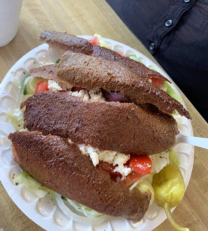 The Greek salad with gyro meat proves that "eating healthy" and "beach vacation" can coexist without sacrificing an ounce of flavor or satisfaction.