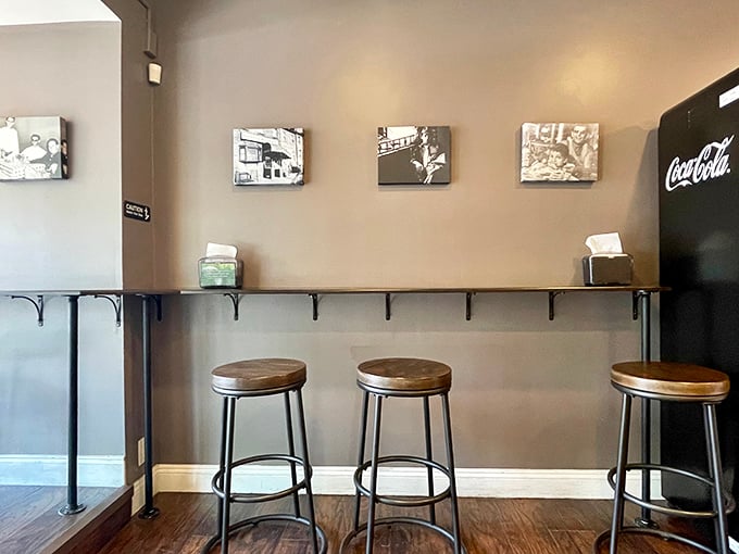 A minimalist seating area that says, "Don't get comfortable&mdash;there's a line outside." Simple stools, clean counters, and black-and-white photos that hint at Philadelphia's rich food history.