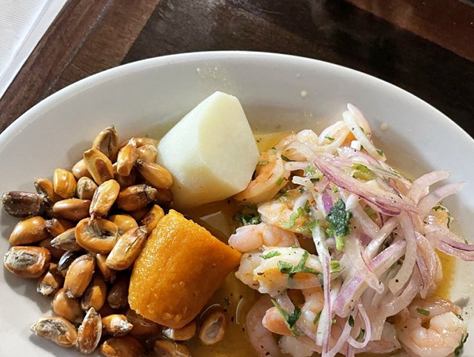 A symphony of seafood in this shrimp ceviche. The pink onions and tender potato create a textural playground for the delicate shellfish.