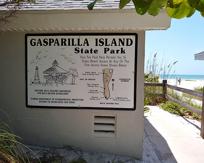 Park planning made simple. This sign maps out your beach adventures while the lighthouse stands guard in the background, a constant navigational companion.