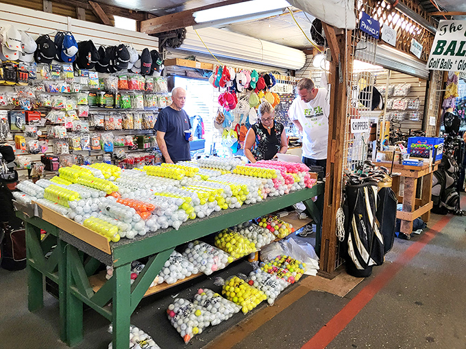 Golf balls stacked like edible pyramids at a fancy reception. The sports enthusiast's candy store, where even beginners can afford to lose a few balls.