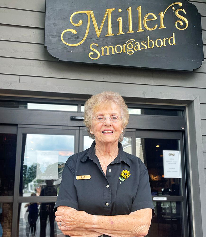 The face of hospitality wears a sunflower pin. Decades of experience means she knows exactly what you'll love before you do.