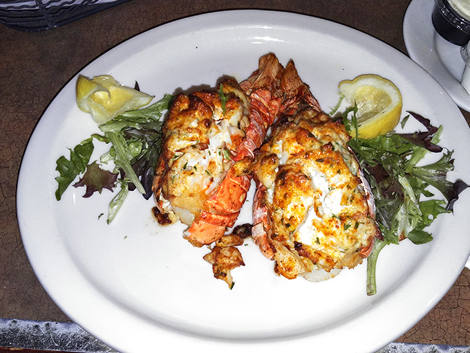 Stuffed lobster tails that make you question why you'd ever eat anything else – decadence served on a pristine white plate.