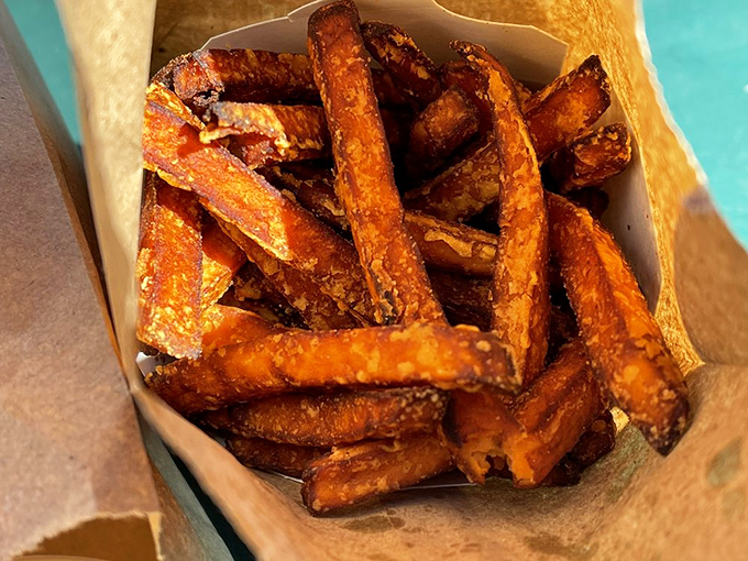 Sweet potato fries that strike the perfect balance between crisp exterior and tender inside. Nature's candy gets the deep-fried treatment it deserves.