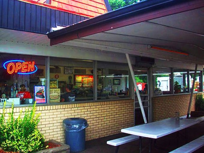 The neon "OPEN" sign glows like a beacon of hope for hungry travelers, promising refuge from chain restaurants and fast-food mediocrity.