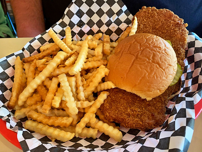 The tenderloin sandwich that launched a thousand road trips. Iowa's unofficial state food comes with a side of perfectly golden crinkle-cut fries.