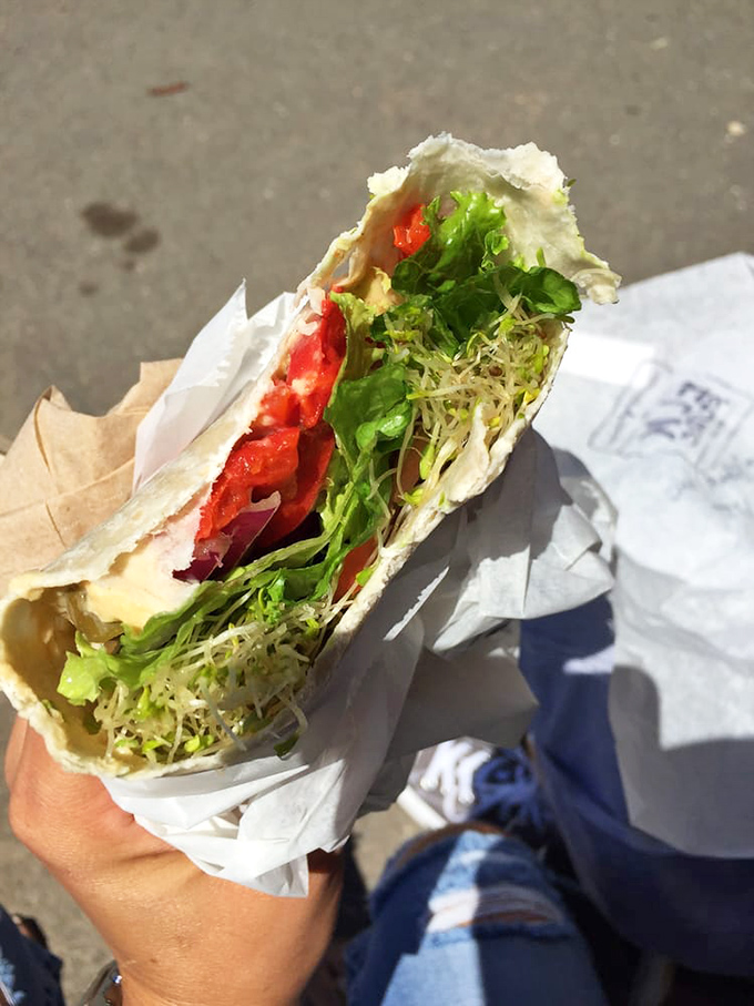 A veggie wrap so fresh and vibrant it makes you temporarily forget about bacon. Those sprouts and tomatoes are practically still photosynthesizing.