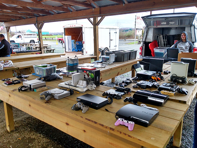 Gaming history displayed across generations&mdash;from Atari to PlayStation. The evolution of entertainment laid bare on rough-hewn wooden tables.