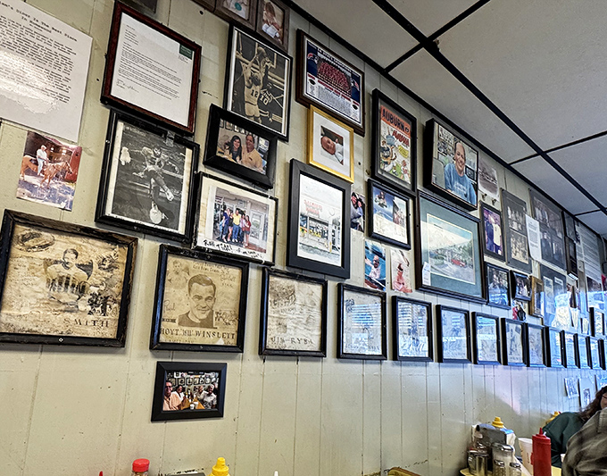 The wall of fame tells stories that menus can't. Each frame holds memories of community connections, championship celebrations, and the diner's place in local history.