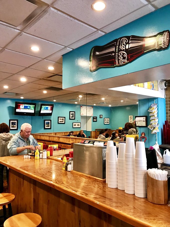 The counter where breakfast dreams come true. Notice the well-worn wood—each scratch tells the story of a satisfied diner.