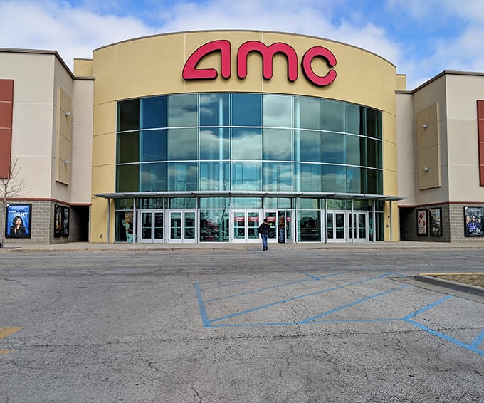The distinctive AMC theater facade at Castleton Square offers post-shopping entertainment after you've bagged all your bargains.