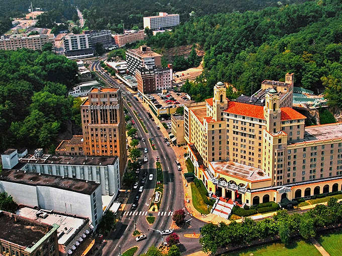 Hot Springs' historic buildings nestle against the mountains. Those grand structures have been welcoming visitors seeking healing waters for generations!