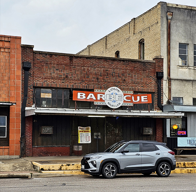 Louie Mueller's weathered brick facade speaks of decades of smoke and dedication to the craft of Texas barbecue.