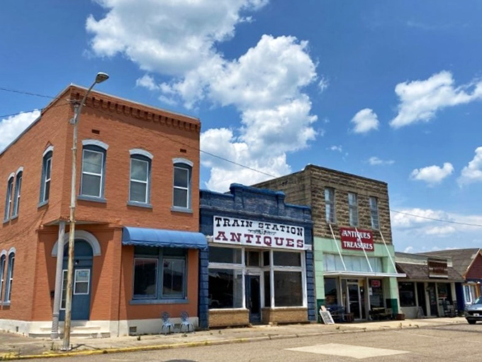 Mena's antique shops occupy buildings nearly as old as their merchandise. That Train Station Antiques sign promises treasure hunting!