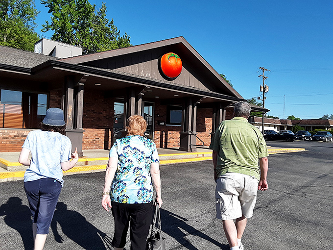 These folks aren't just walking toward Monical's&mdash;they're embarking on a quest for that signature sweet sauce and crispy crust.