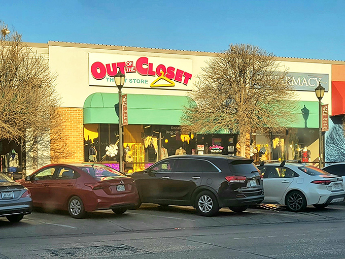 Out of the Closet's vibrant sign pops against the neutral building. Shopping with purpose never looked so inviting!