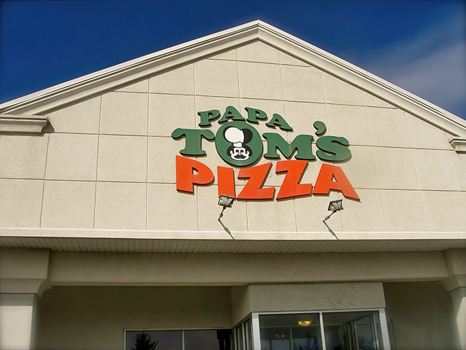 Papa Tom's cracked sign tells you they've been too busy making great pizza to worry about fancy renovations. Priorities!