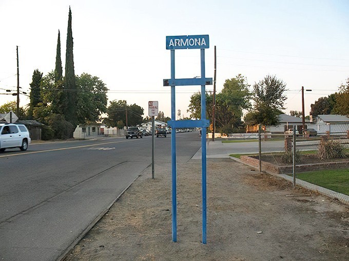 Armona's simple blue sign welcomes you to a town where housing costs have seemingly remained frozen in a more affordable era.