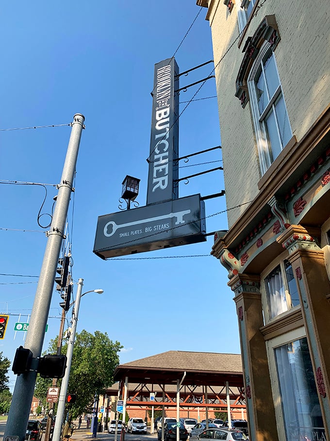 That vertical "BUTCHER" sign isn't just for show—it's pointing the way to some of the finest dry-aged beef in southern Indiana.