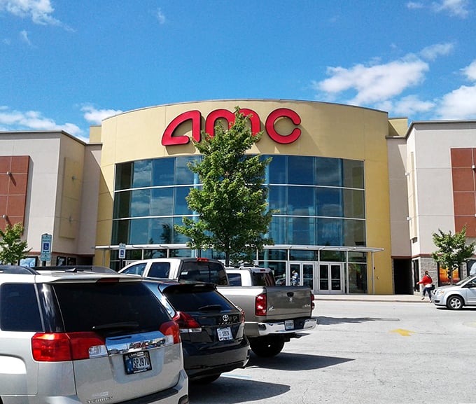Sunshine bathes the AMC theater entrance at Castleton Square, where smart shoppers combine movie outings with outlet adventures.