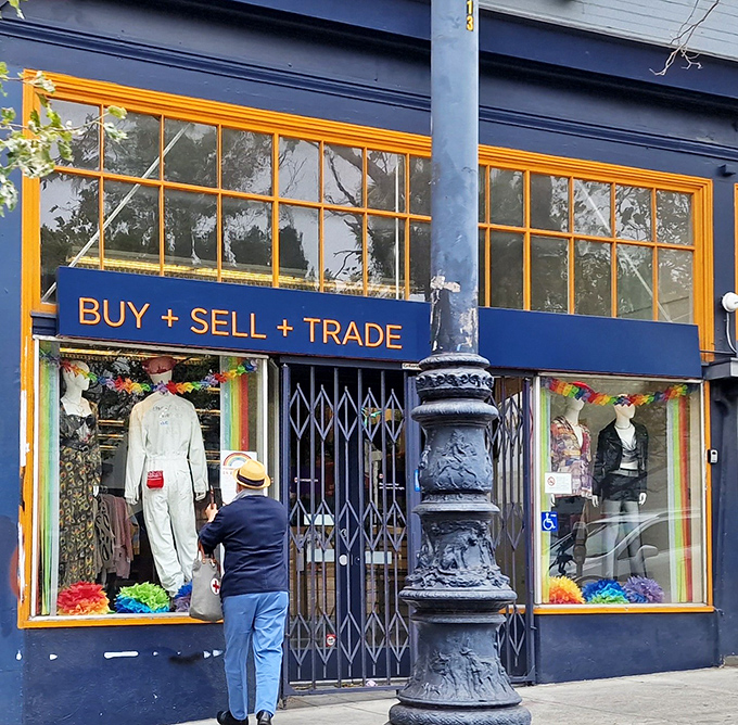 Window shoppers pause to admire displays that blur the line between "pre-loved" and "luxury" on Market Street.