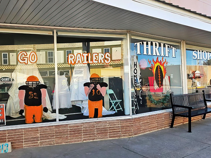"Go Raiders" spirit fills the windows of this small-town thrift shop&mdash;where school pride meets bargain hunting.