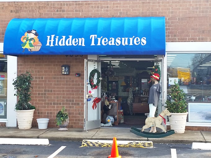 Holiday decorations peek out from this aptly named treasure trove. The blue awning signals bargain waters ahead!