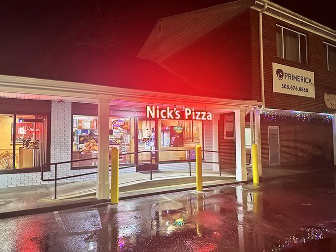 Nick's glowing sign cuts through the night like a pizza bat-signal, calling hungry heroes to its delicious rescue.