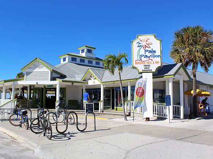 Classic Florida beach vibes in architectural form. Palm Pavilion's green-trimmed perfection is the poster child for coastal dining.