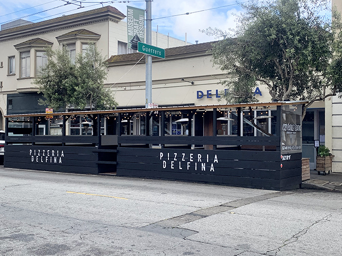 The outdoor seating at Pizzeria Delfina invites you to enjoy your Neapolitan-style pie while watching the Mission District world go by.