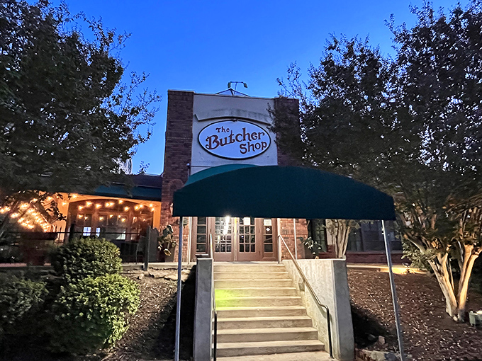 As evening falls, The Butcher Shop transforms into a cozy haven for serious steak enthusiasts.