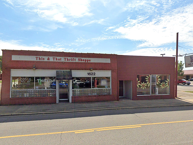 Hand-painted window displays give This & That a charming, personal touch that big box stores can't match.