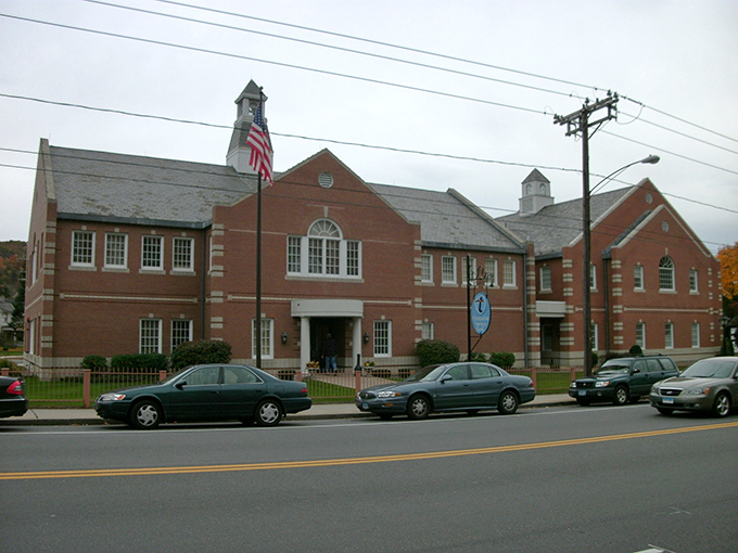 This former bank building in Thomaston now serves a new purpose, its classical columns standing guard over a town where history and affordability meet.