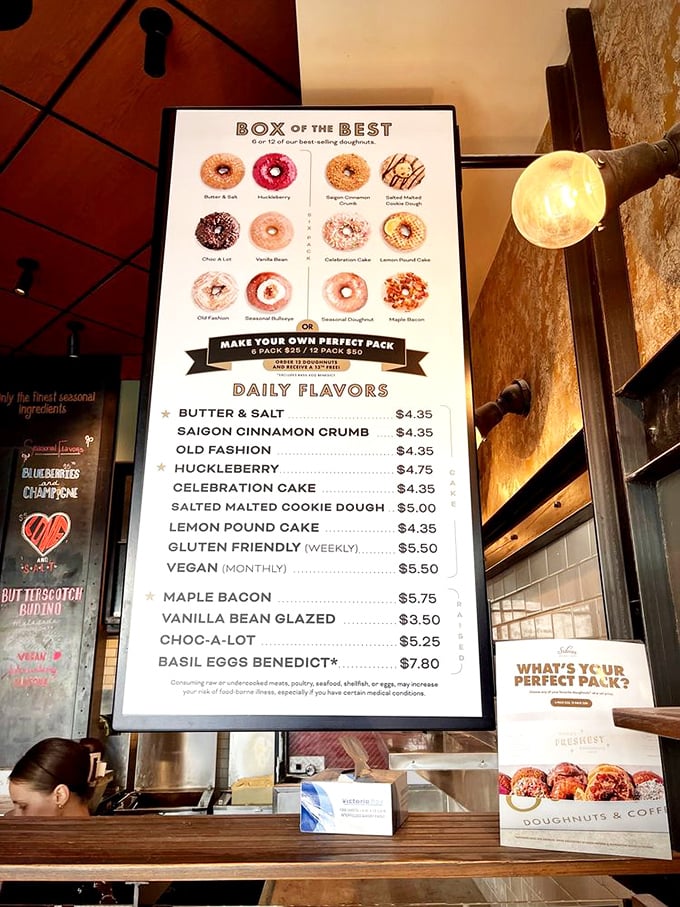 The menu board reads like a love letter to donut possibilities. That huckleberry listing is the siren call of sweet perfection.