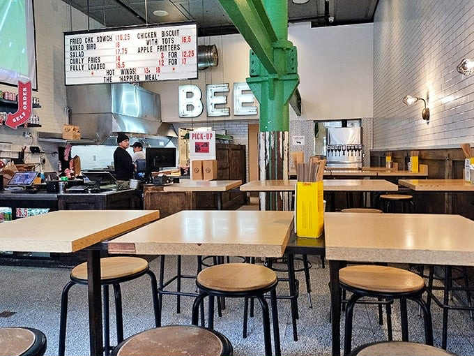 Industrial-chic meets comfort food haven. The "BEE" sign is just letting you know you're about to experience something worth buzzing about.