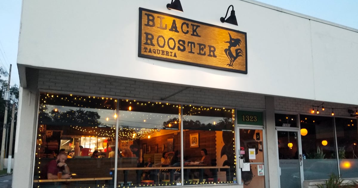 The unassuming storefront of Black Rooster Taqueria beckons like a secret handshake among Orlando foodies. Those wooden benches have witnessed countless taco-induced smiles.