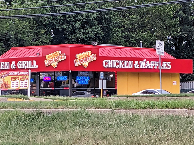 The bright red roof of Legends stands like a culinary lighthouse, beckoning hungry travelers with neon promises of chicken salvation in Hyattsville.