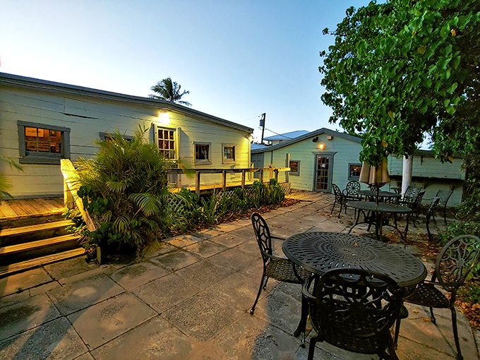 The weathered blue exterior of Cap's Place stands as a defiant time capsule on Florida's coast, promising seafood adventures that Instagram filters can't replicate. 